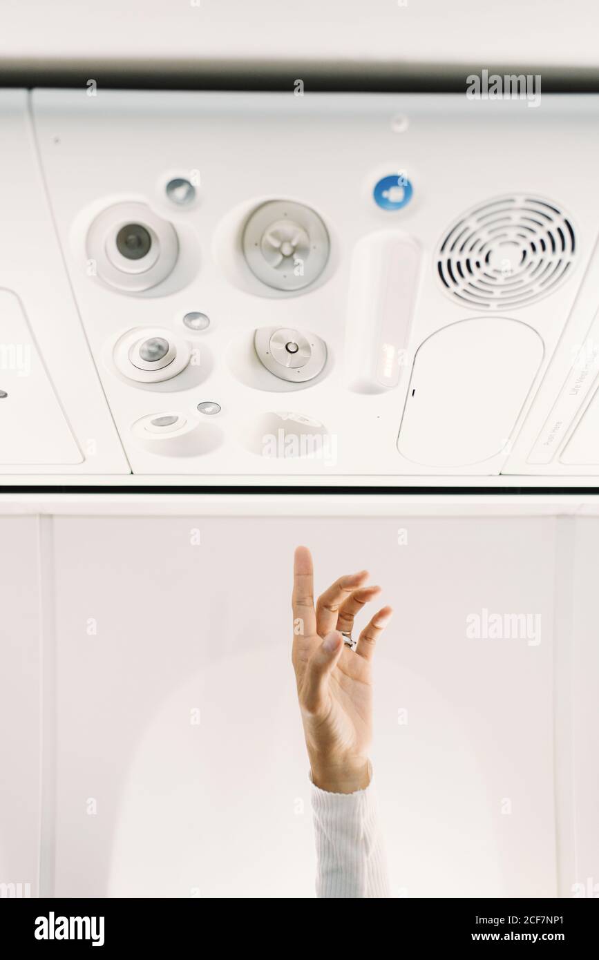 person pressing button on panel up airplane Stock Photo - Alamy