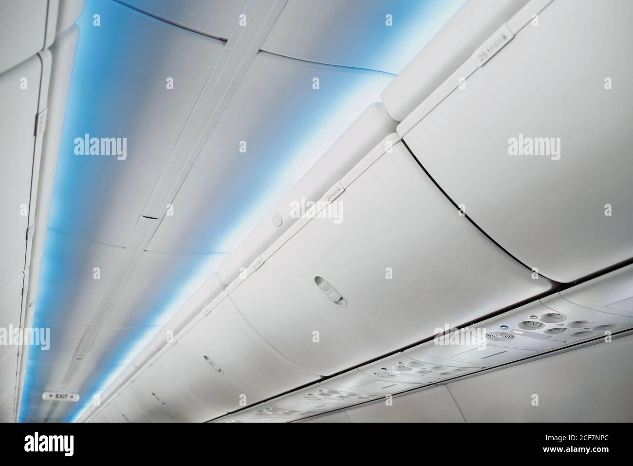 White aircraft ceiling compartment with different buttons Stock Photo ...