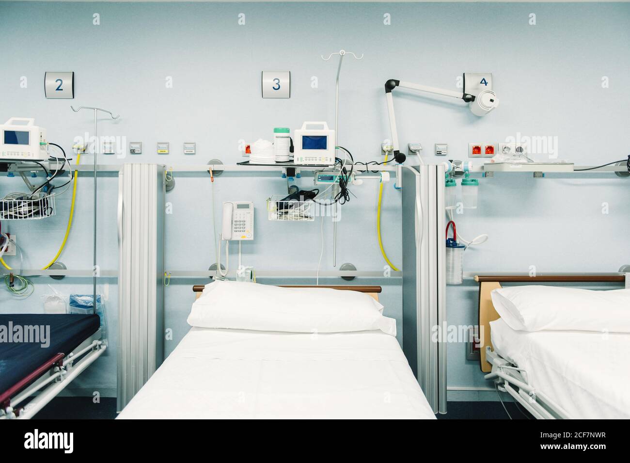 Equipped intensive care unit with beds made up for patients and metal ...