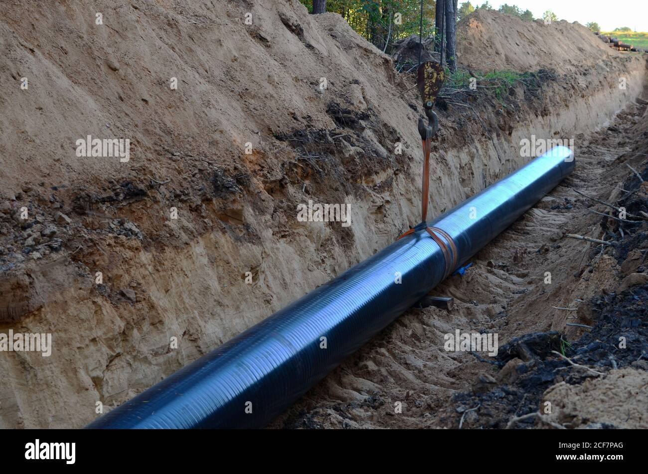 Natural gas pipeline construction work. A dug trench in the ground for ...