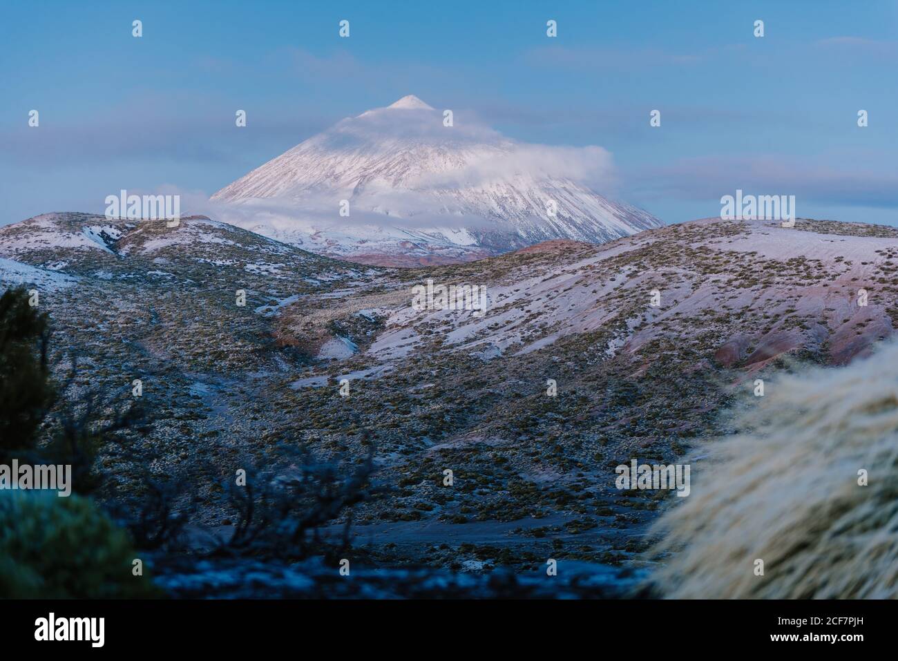 Majestic view of white clouds and wonderful snowy mountain peak against ...