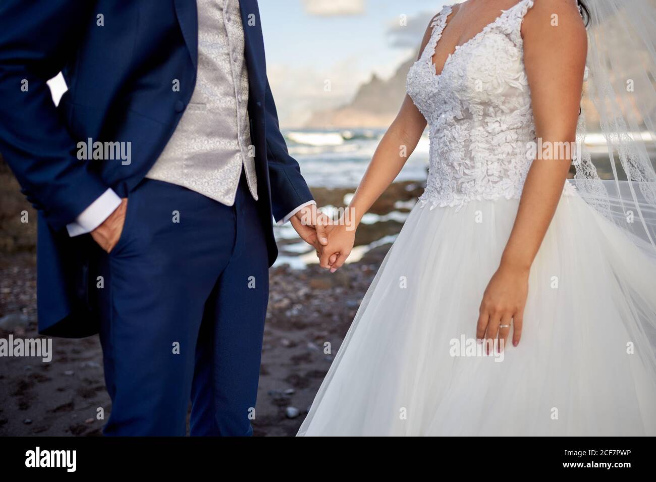 unrecognizable crop groom in classy tuxedo and bride in elegant wedding ...