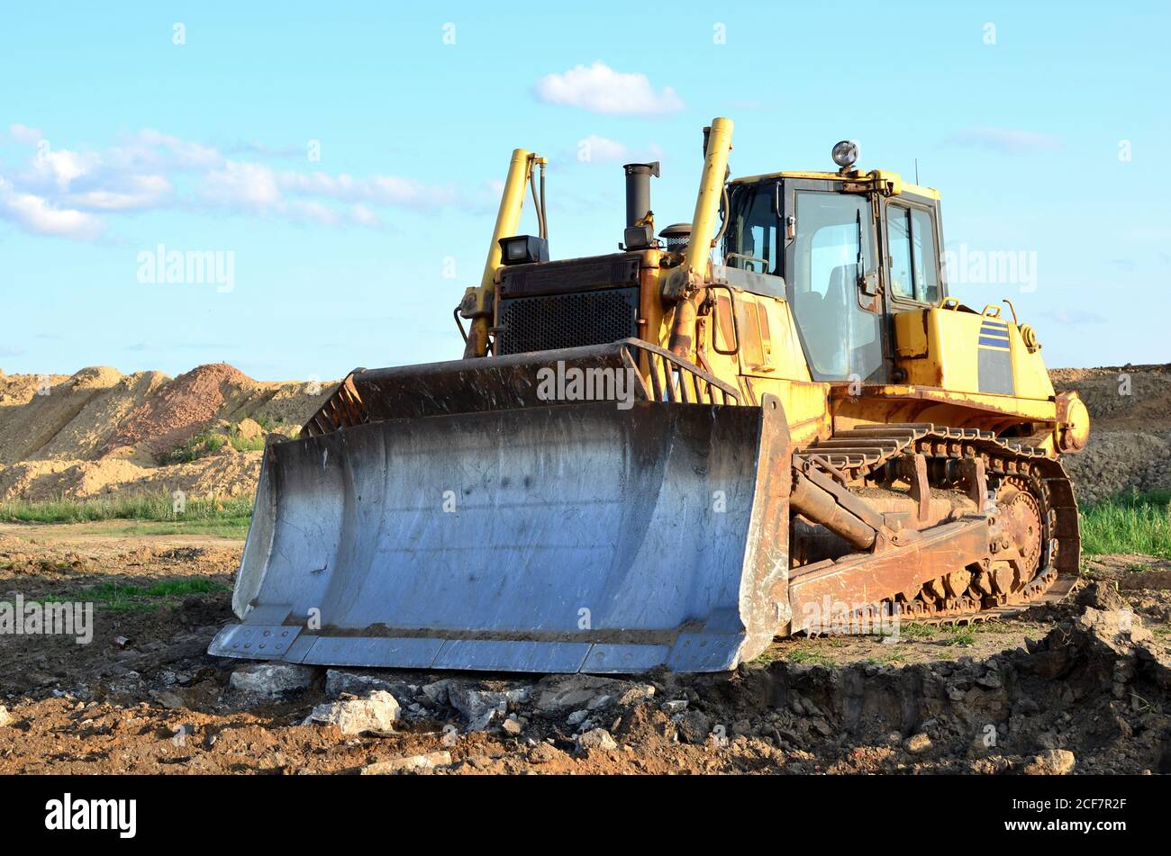 Bulldozer with bucket for pool excavation and utility trenching. Dozer ...