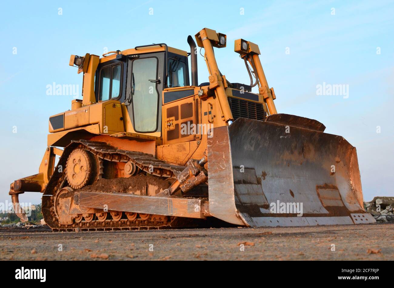 Bulldozer during of large construction jobs at building site. Land ...