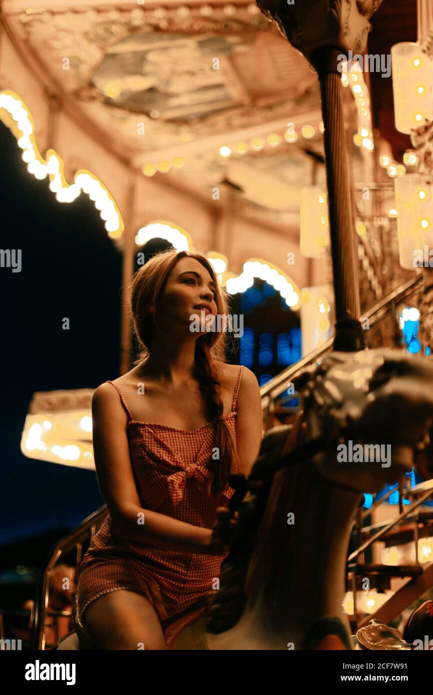 Woman riding carousel horse hi-res stock photography and images - Alamy