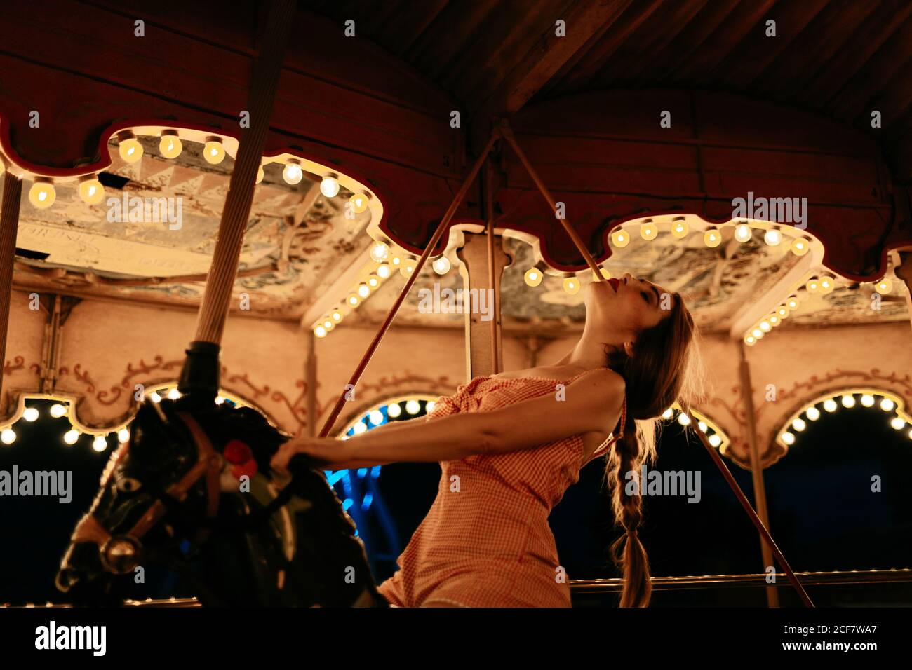 Woman riding carousel horse hi-res stock photography and images - Alamy
