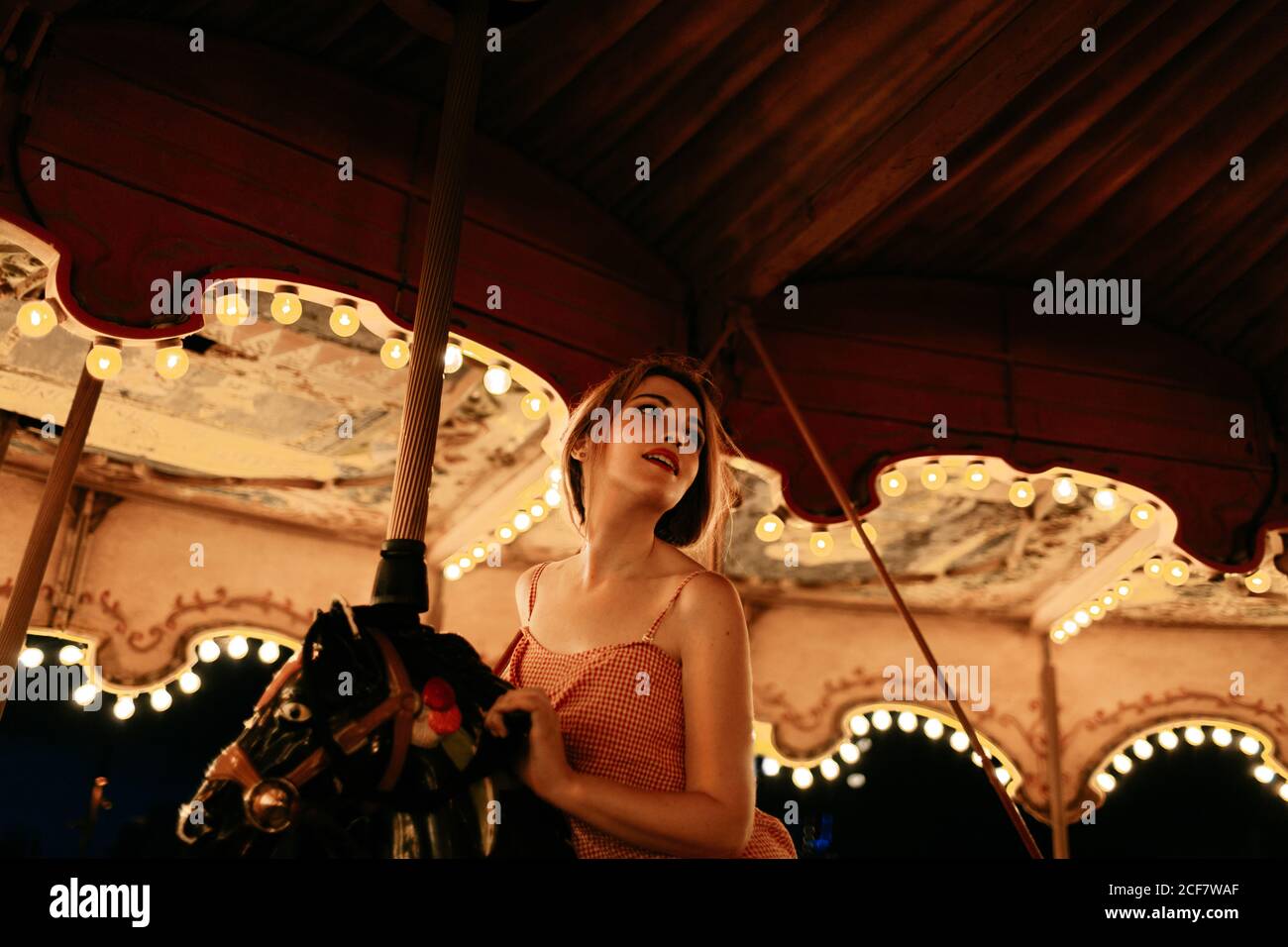 Woman riding carousel horse hi-res stock photography and images - Alamy