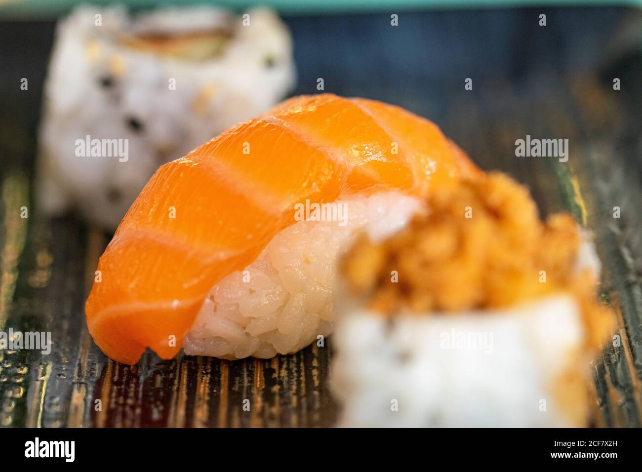 a close up image of a selection of different sushi styles on a plate ...