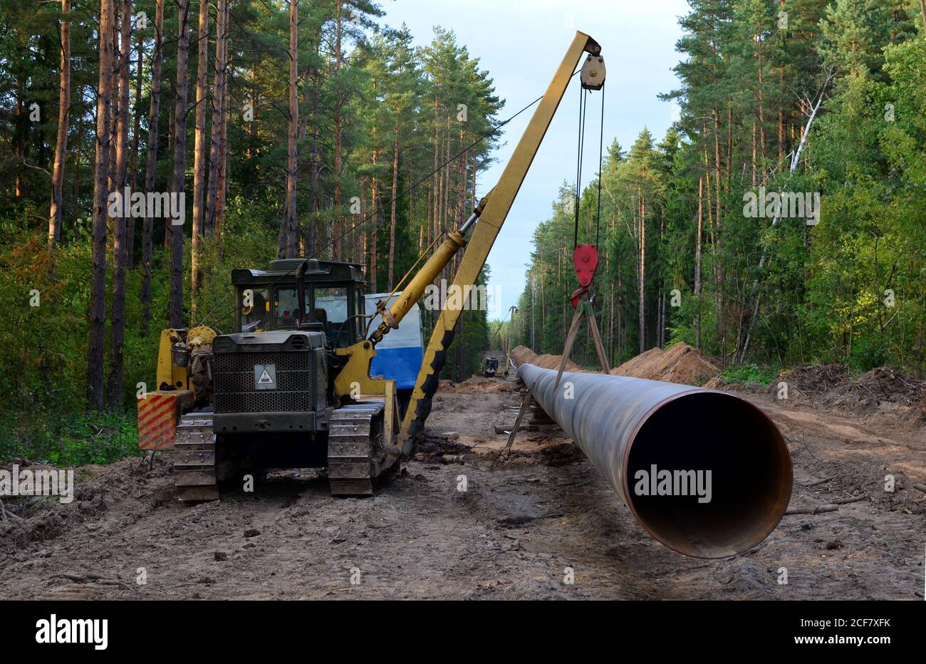 Natural gas pipeline construction work. A dug trench in the ground for ...
