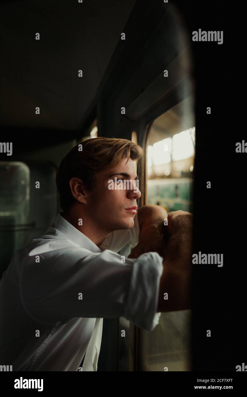 Traveler looking out train window Stock Photo - Alamy