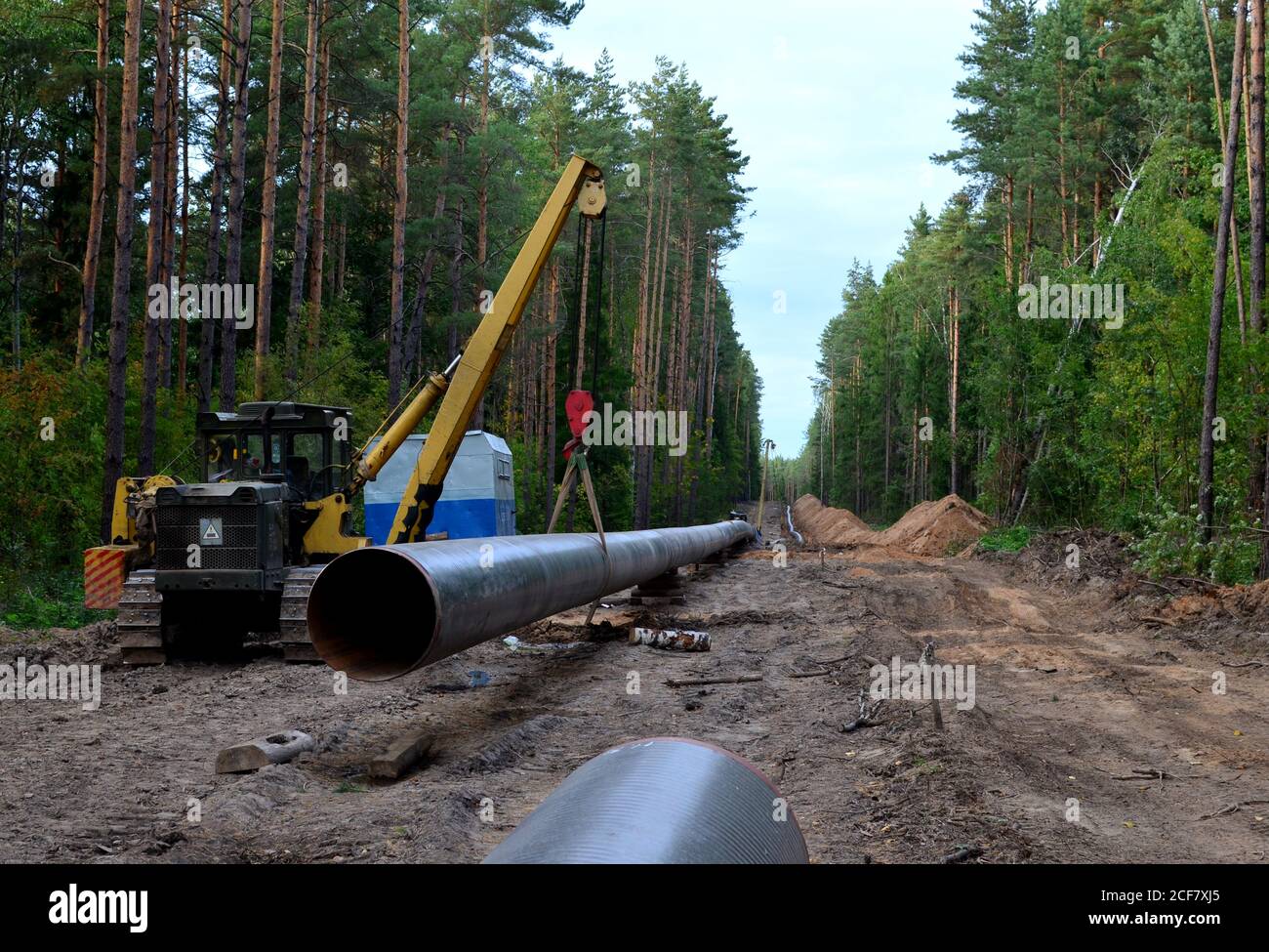 Natural gas pipeline construction work. A dug trench in the ground for ...