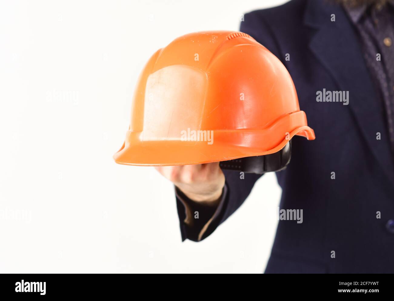 helmet in hands of abstract sanitary or electrical engineer isolated on ...