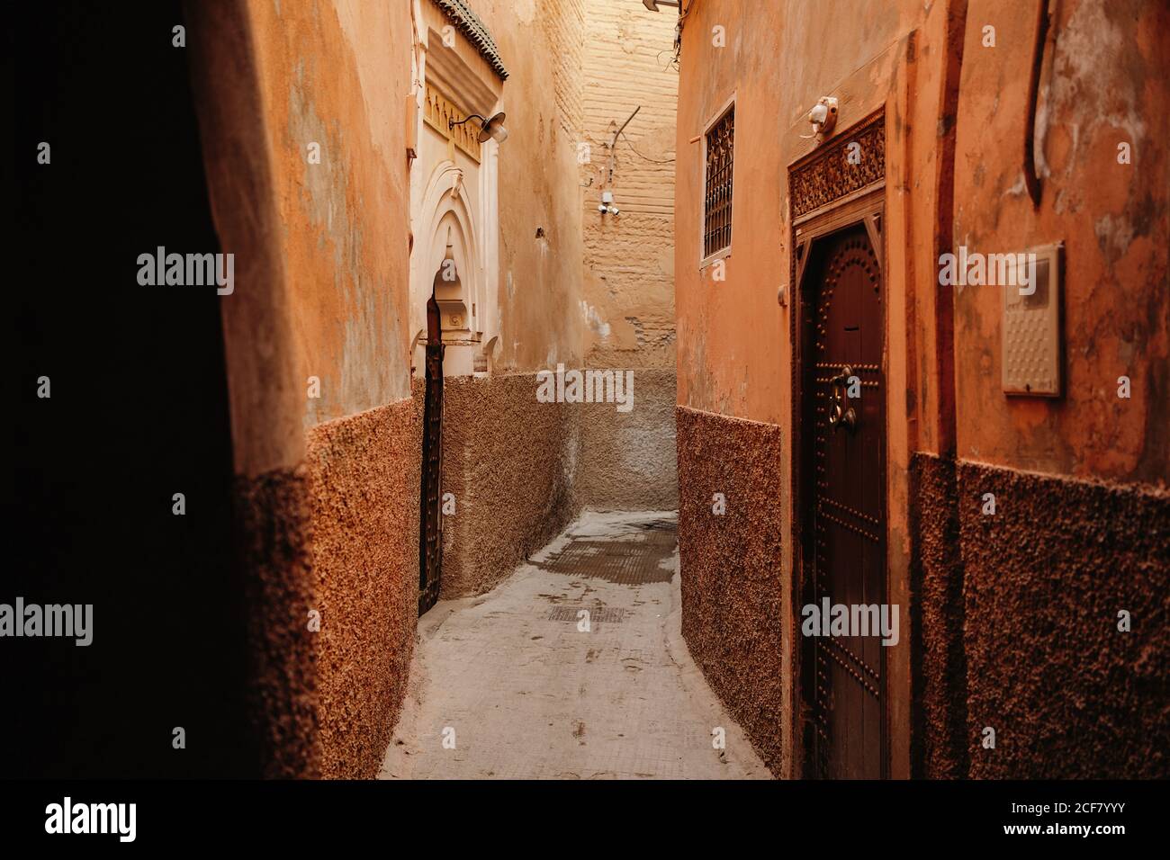 Narrow passage between old stone houses in traditional Arabic style ...