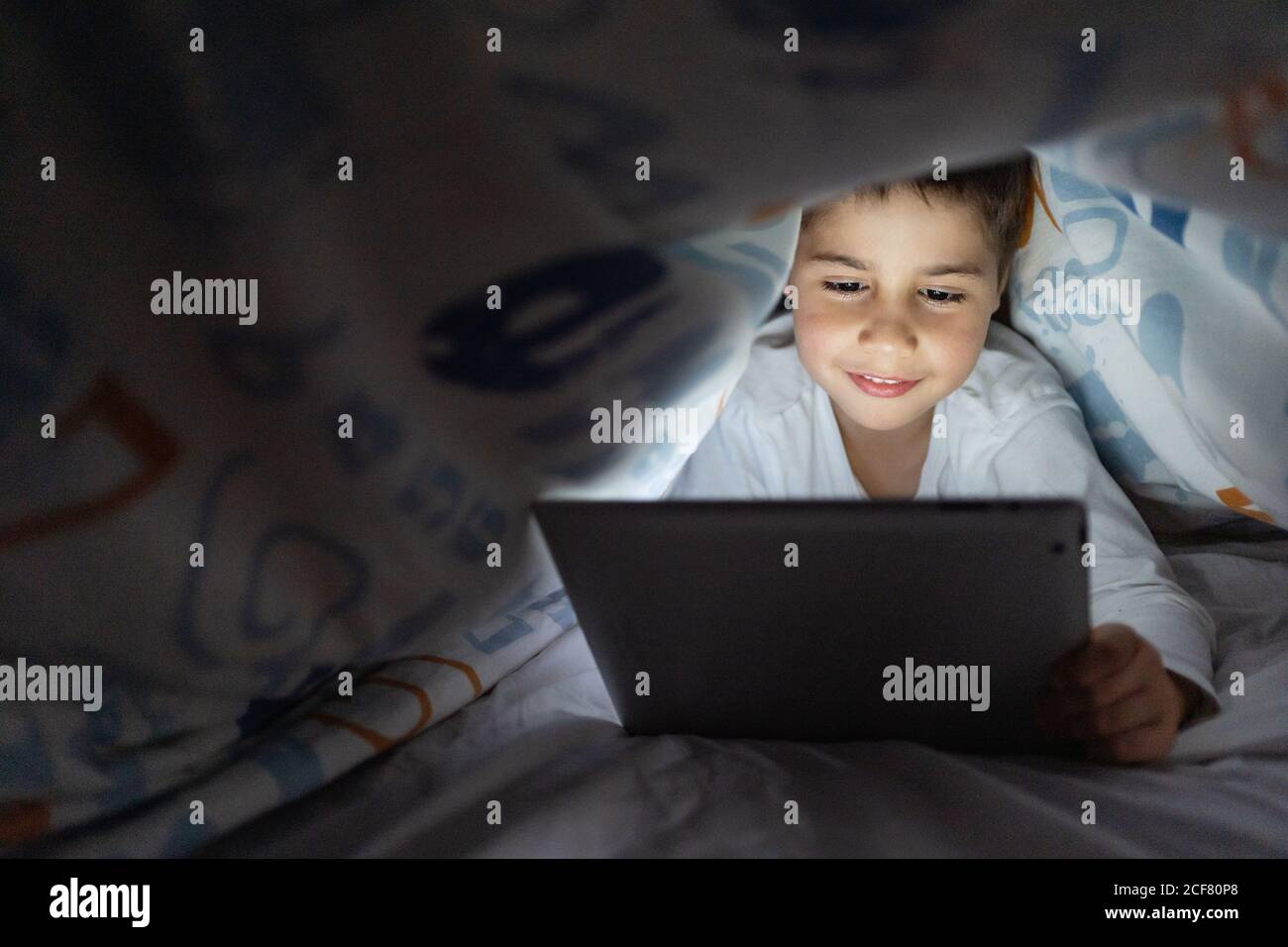Kid hiding under blanket hi-res stock photography and images - Alamy