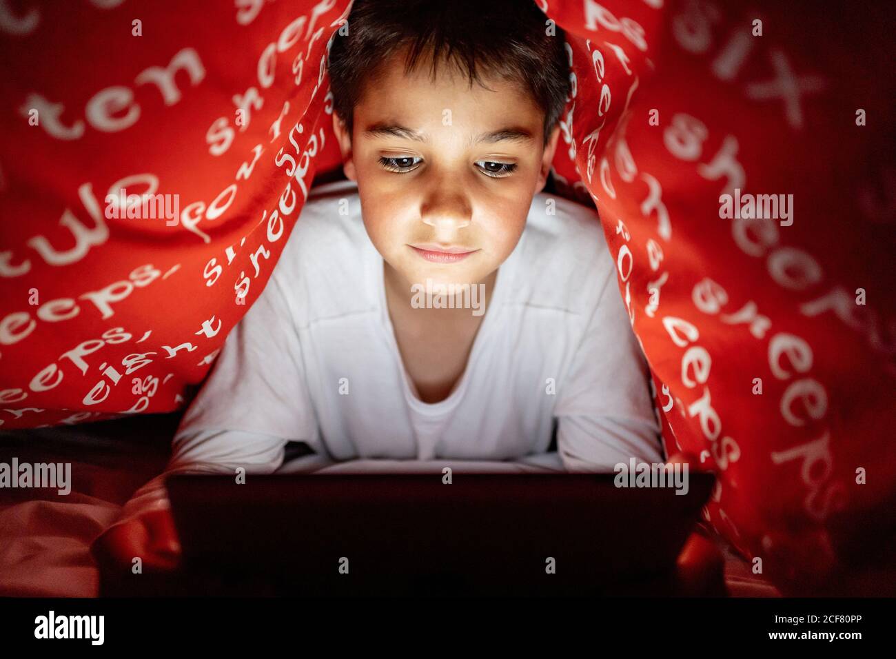 Kid hiding under blanket hi-res stock photography and images - Alamy