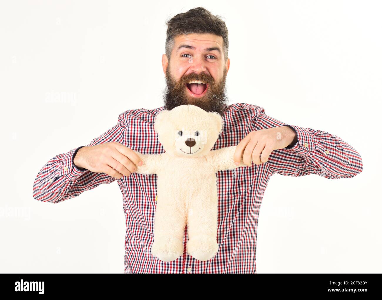 Lovely portrait of a young man holding a teddy bear, isolated on white ...