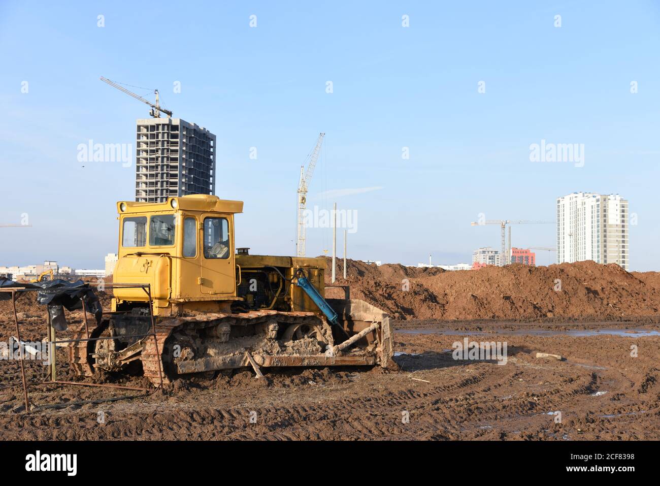 Bulldozer during of large construction jobs at building site. Crawler ...