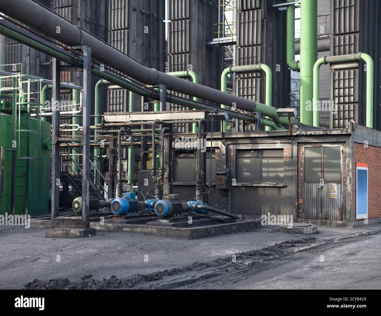 Low angle of manufacture building of factory with coke batteries and ...