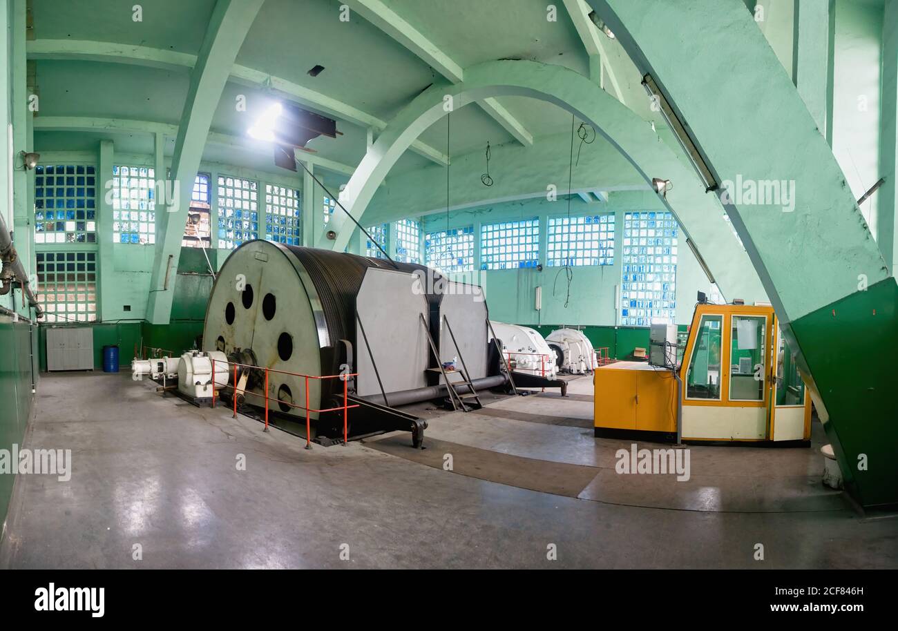 Large gray metal circular machine and yellow instrument room locating ...