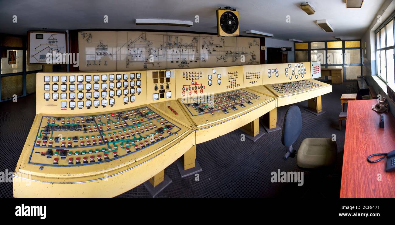 Yellow old dashboards with many buttons sensors and dials in control ...