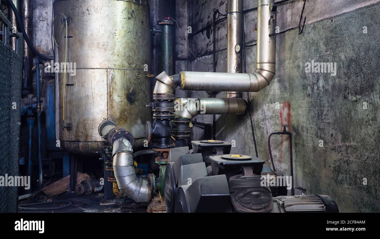 Shabby giant metal cylinder metal deposit frame structure abandoned in ...