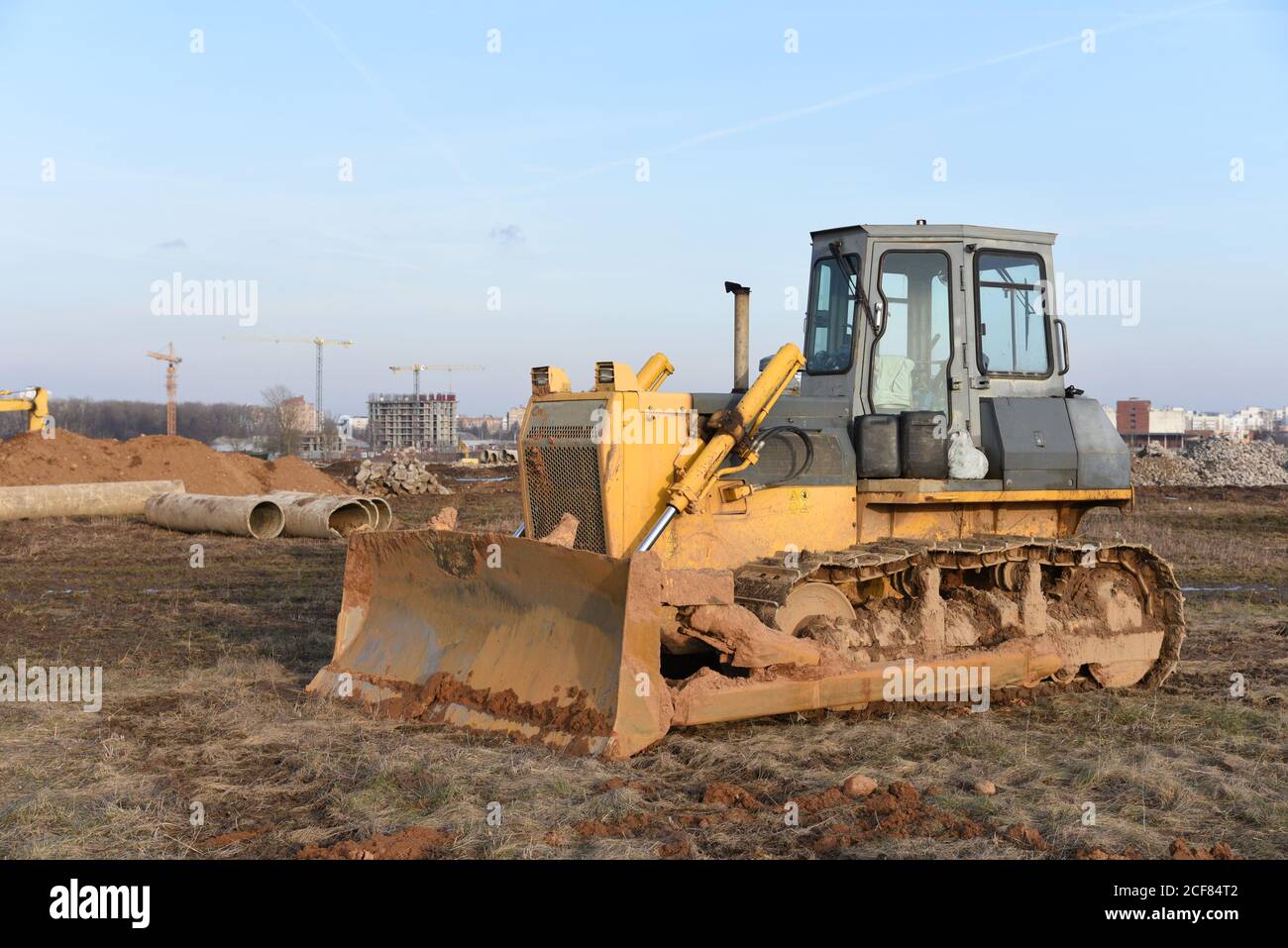 Bulldozer at construction site. Heavy equipment for digging, demolition ...