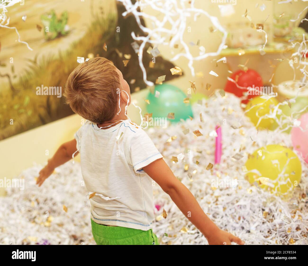 Little boy jumping and having fun celebrating birthday. Portrait of a ...