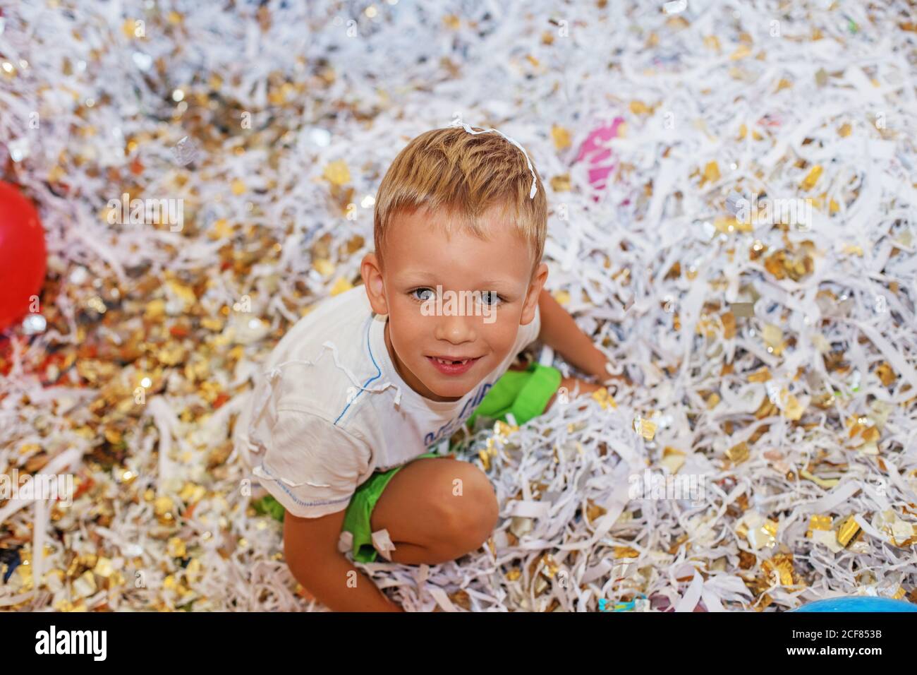 Little boy jumping and having fun celebrating birthday. Portrait of a ...