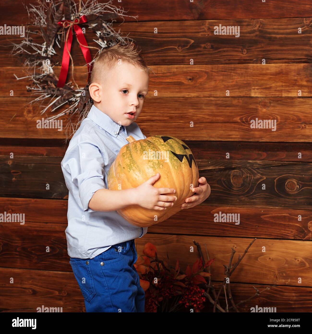 Cute Little Boy having fun in Halloween decorations. Halloween party ...