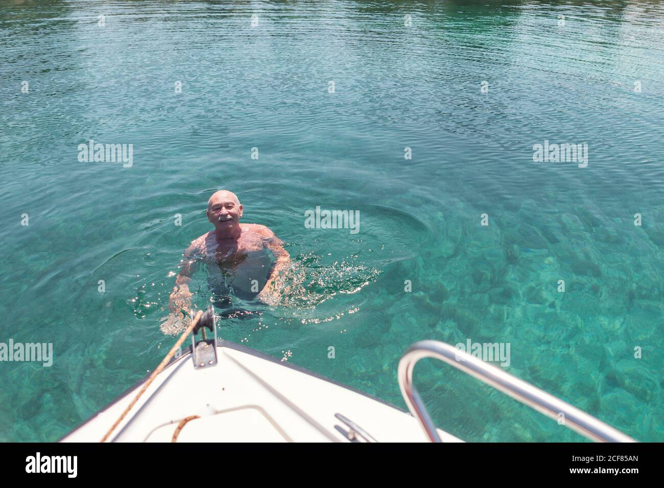 Old man swimming floating in hi-res stock photography and images - Alamy