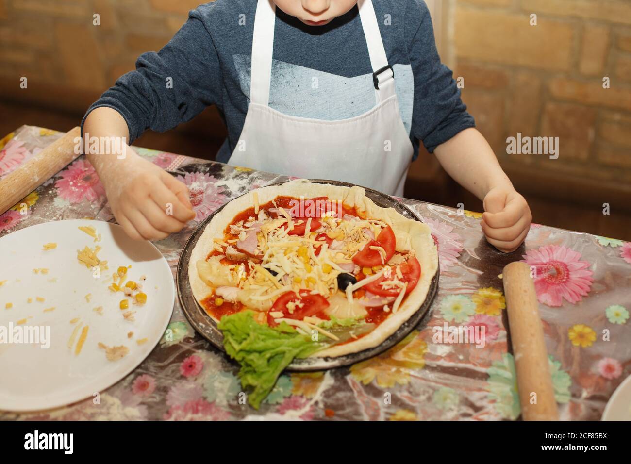 Children make pizza. Master class for children on cooking Italian pizza ...