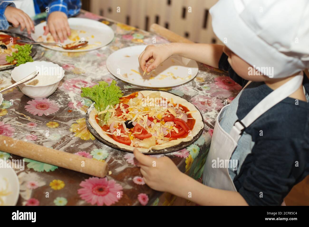Children make pizza. Master class for children on cooking Italian pizza ...