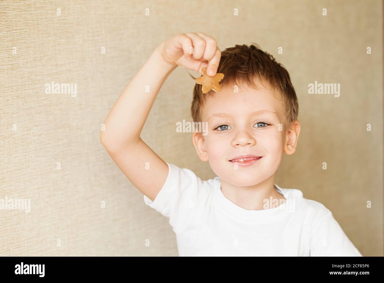 Children's hands make gingerbread. Small boy cutting cookies for ...