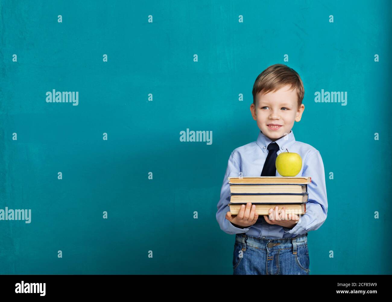 Book, school, kid. little student holding books. Cheerful smiling ...