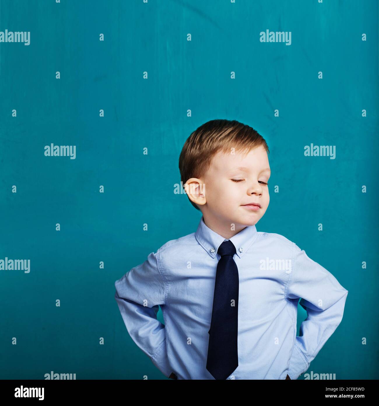 Portrait of a little boy winking and blinking Stock Photo - Alamy