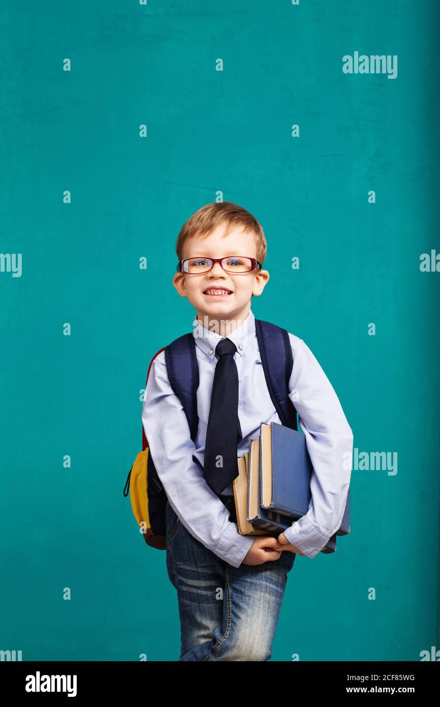 Book, school, kid. little student holding books. Cheerful smiling ...