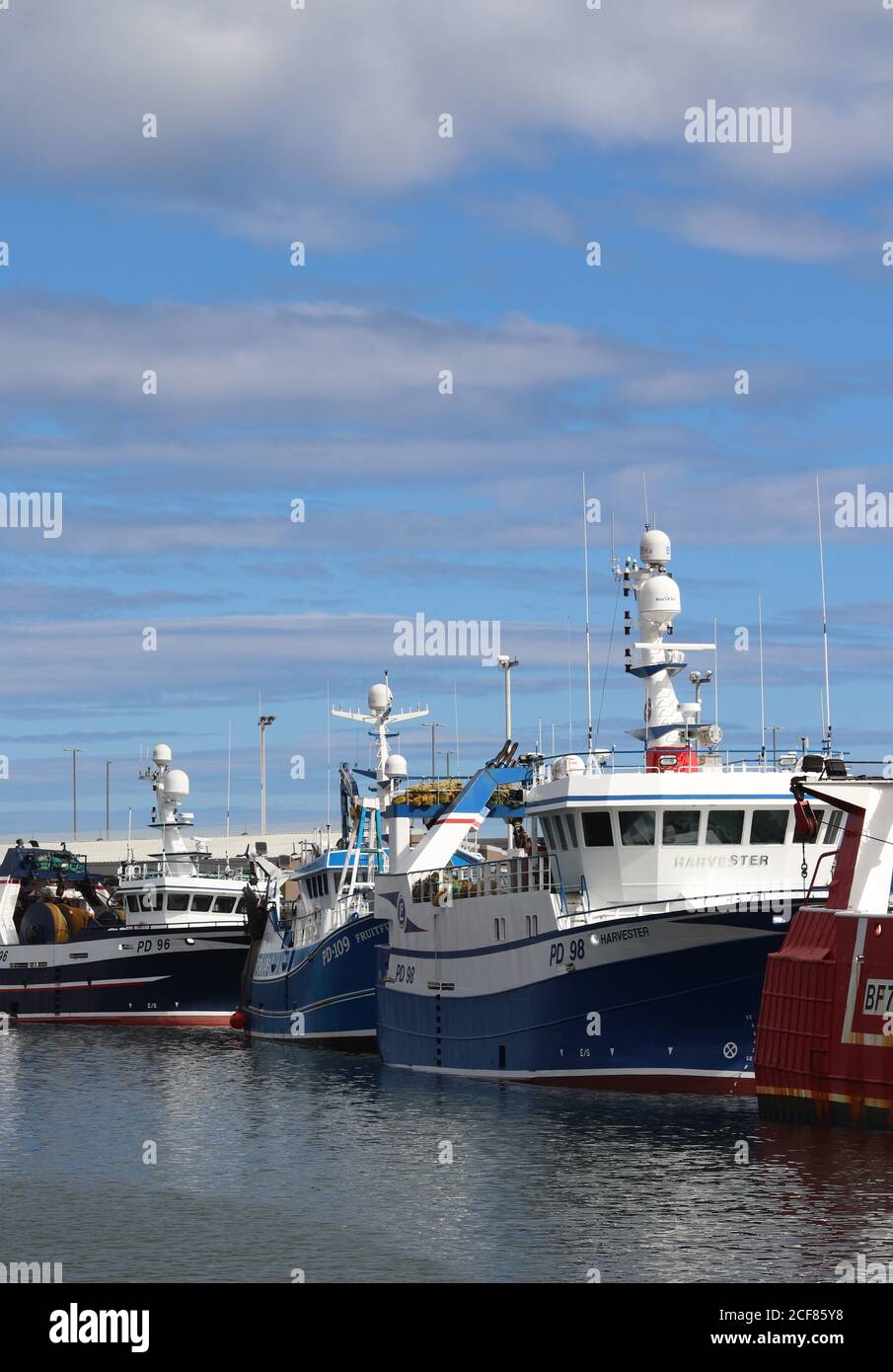Fishing boats in harbour Stock Photo - Alamy