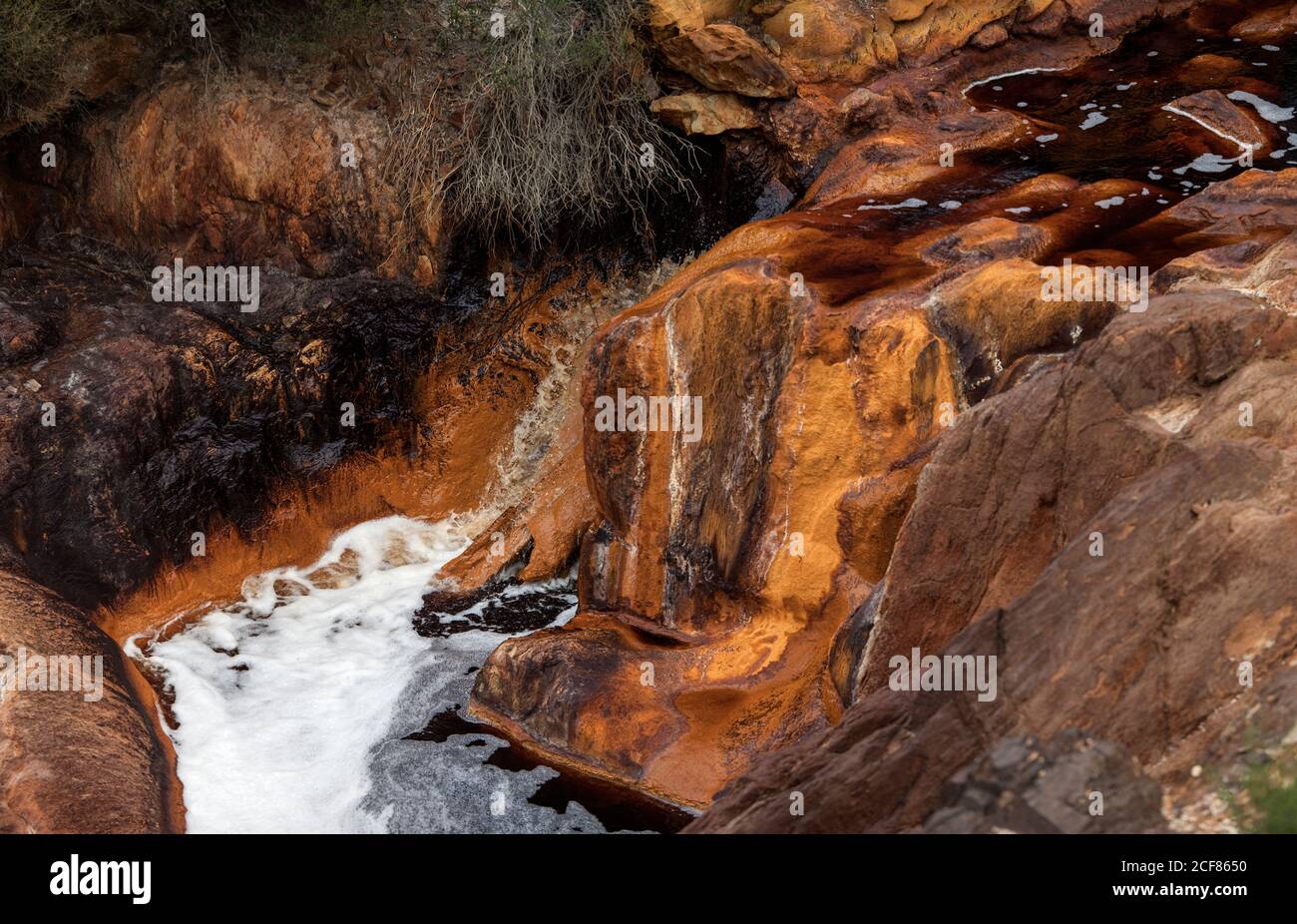 Small red river waterfall of rocky landscape in Riotinto, Huelva Stock ...