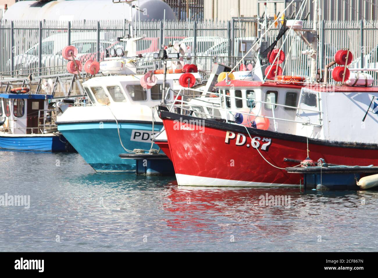 Fishing boats in harbour Stock Photo - Alamy
