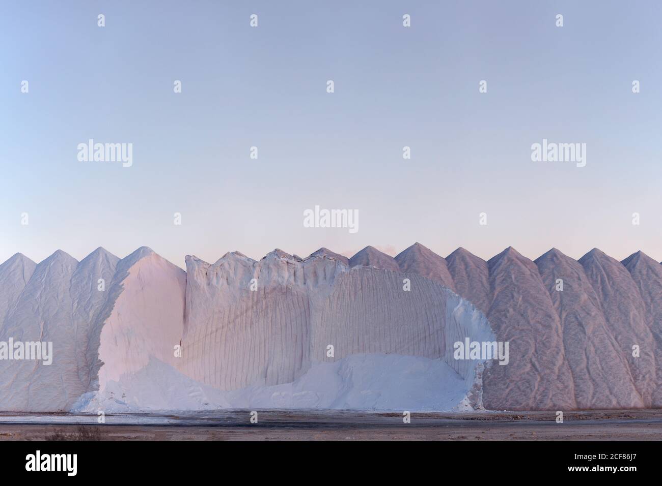 Concept of piles of salt marsh and blue heaven Stock Photo - Alamy