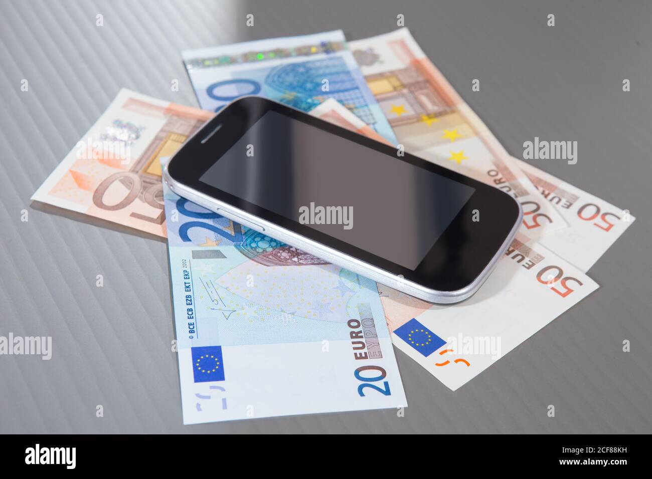 Smart phone euro banknotes hi-res stock photography and images - Alamy
