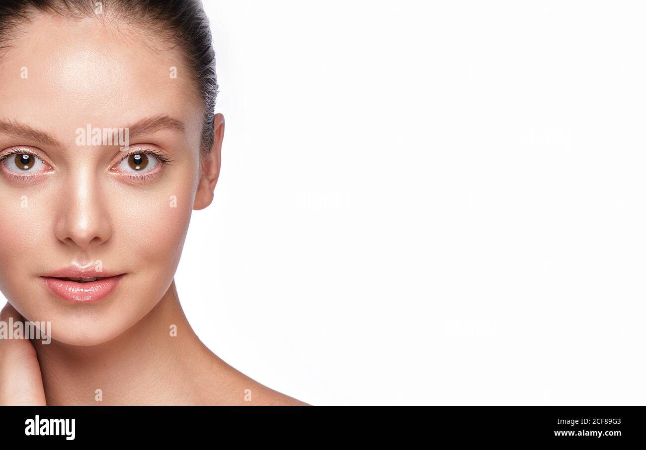 Beautiful young girl with a light natural make-up and perfect skin ...