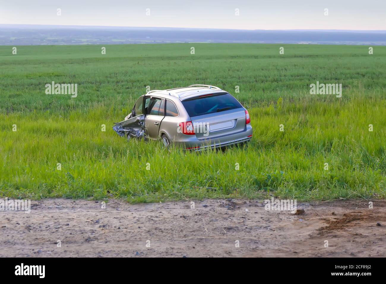 broken by car after accident in field at road Stock Photo - Alamy