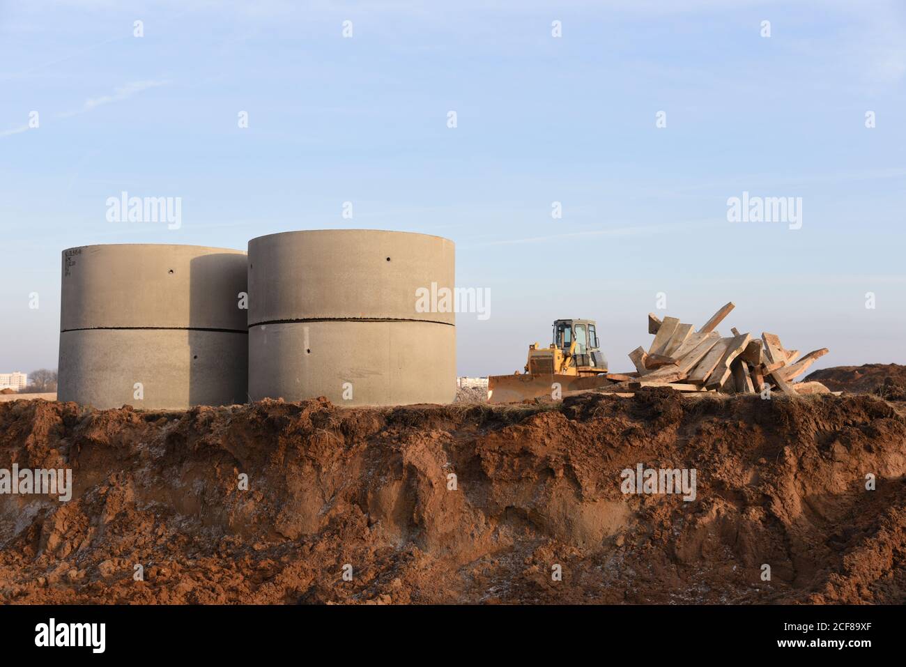 Laying of underground storm sewer pipes in ditch. Installation of water ...