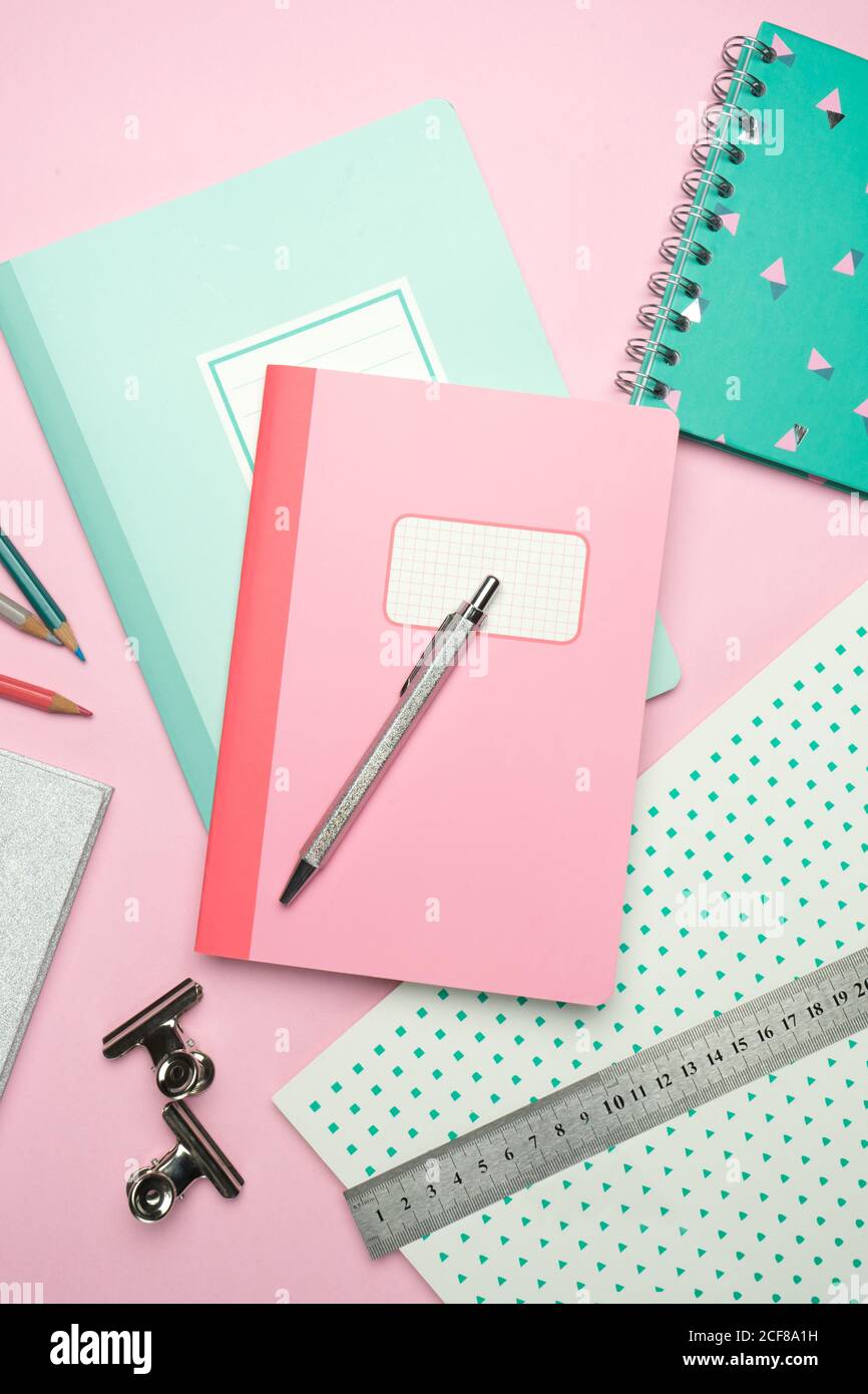 From above composition of colorful notebooks, pen, pencils, ruler and ...