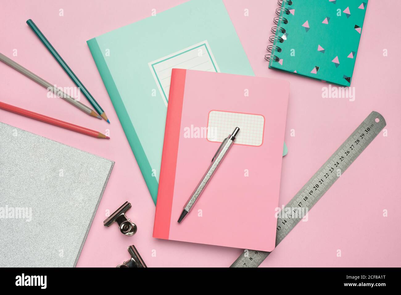 From above composition of colorful notebooks, pen, pencils, ruler and ...