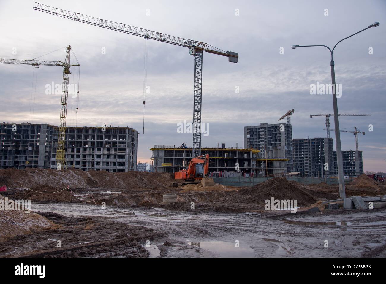 Crawler excavator at construction site on the background of tower ...