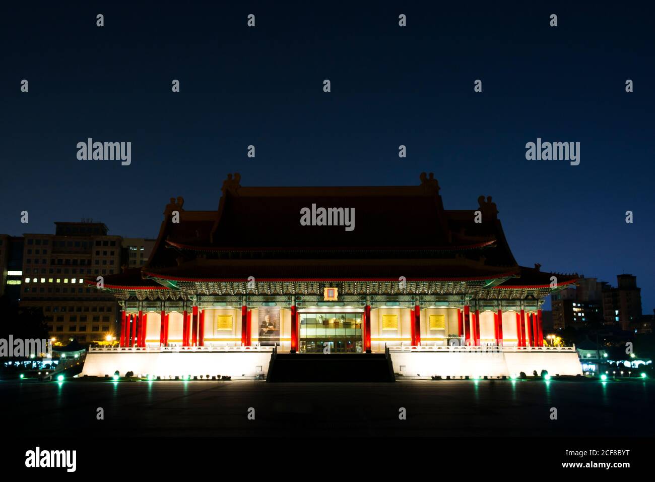 Asian architecture building in plaza at night Stock Photo - Alamy