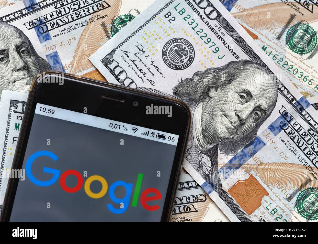 In this photo illustration a Google logo is seen displayed on a ...