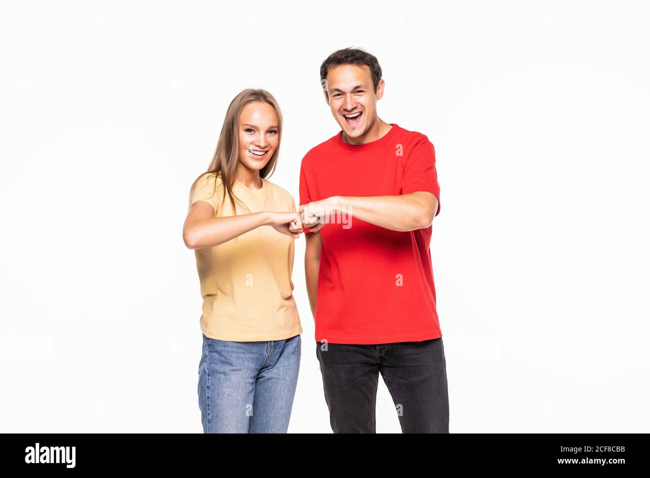 Happy young woman and man friends couple give fist bump isolated on ...